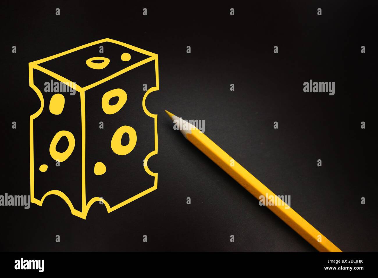 Cheese drawing on black paper with yellow pencil besides. Cheese in a ...