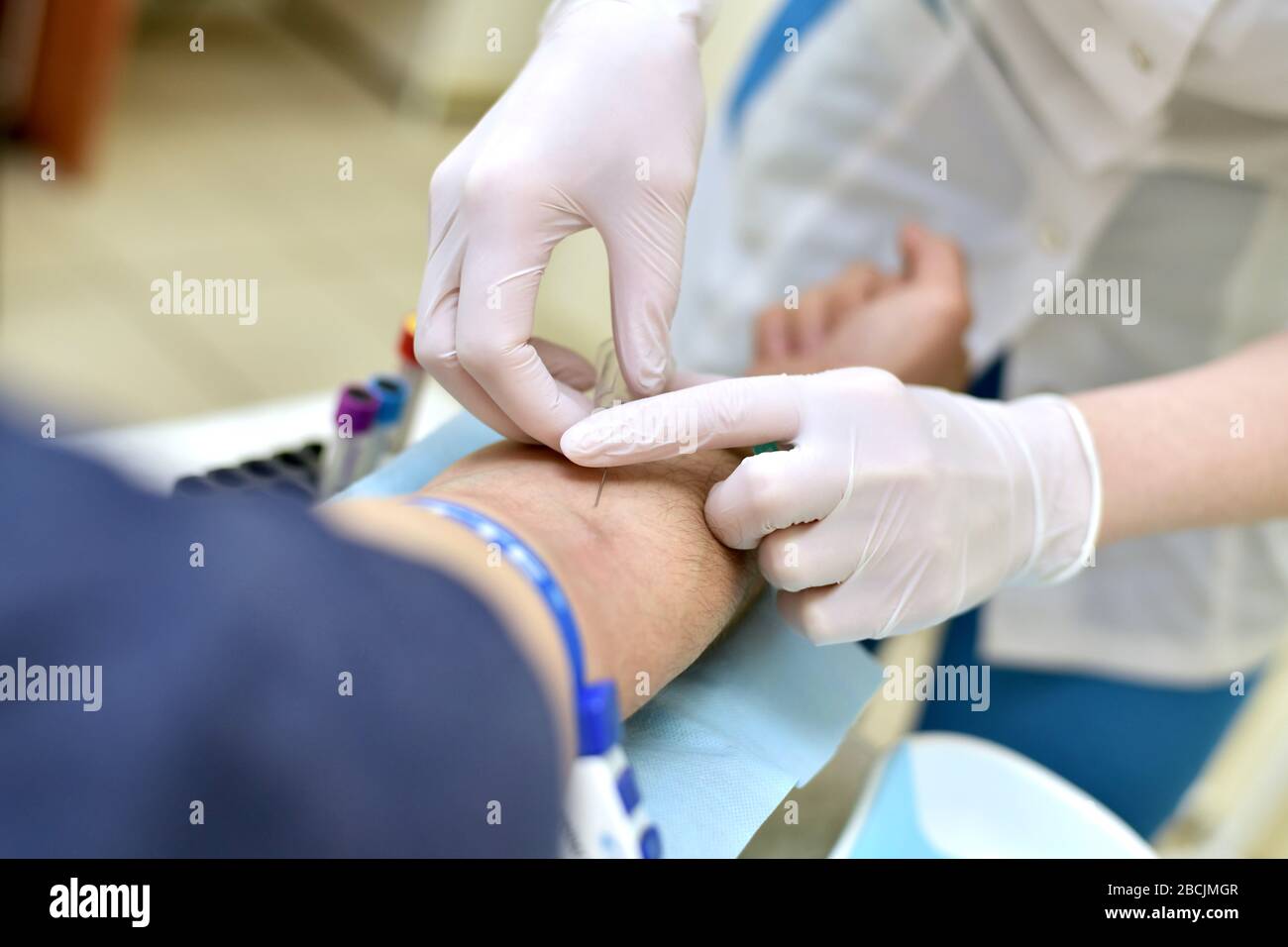 Taking venous blood from a patient in a laboratory. Puncture step of ...