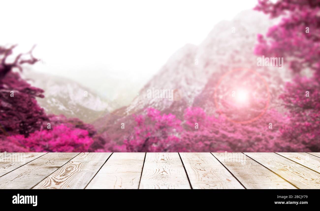 Wooden desk in front of the purple mountain landscape Stock Photo - Alamy