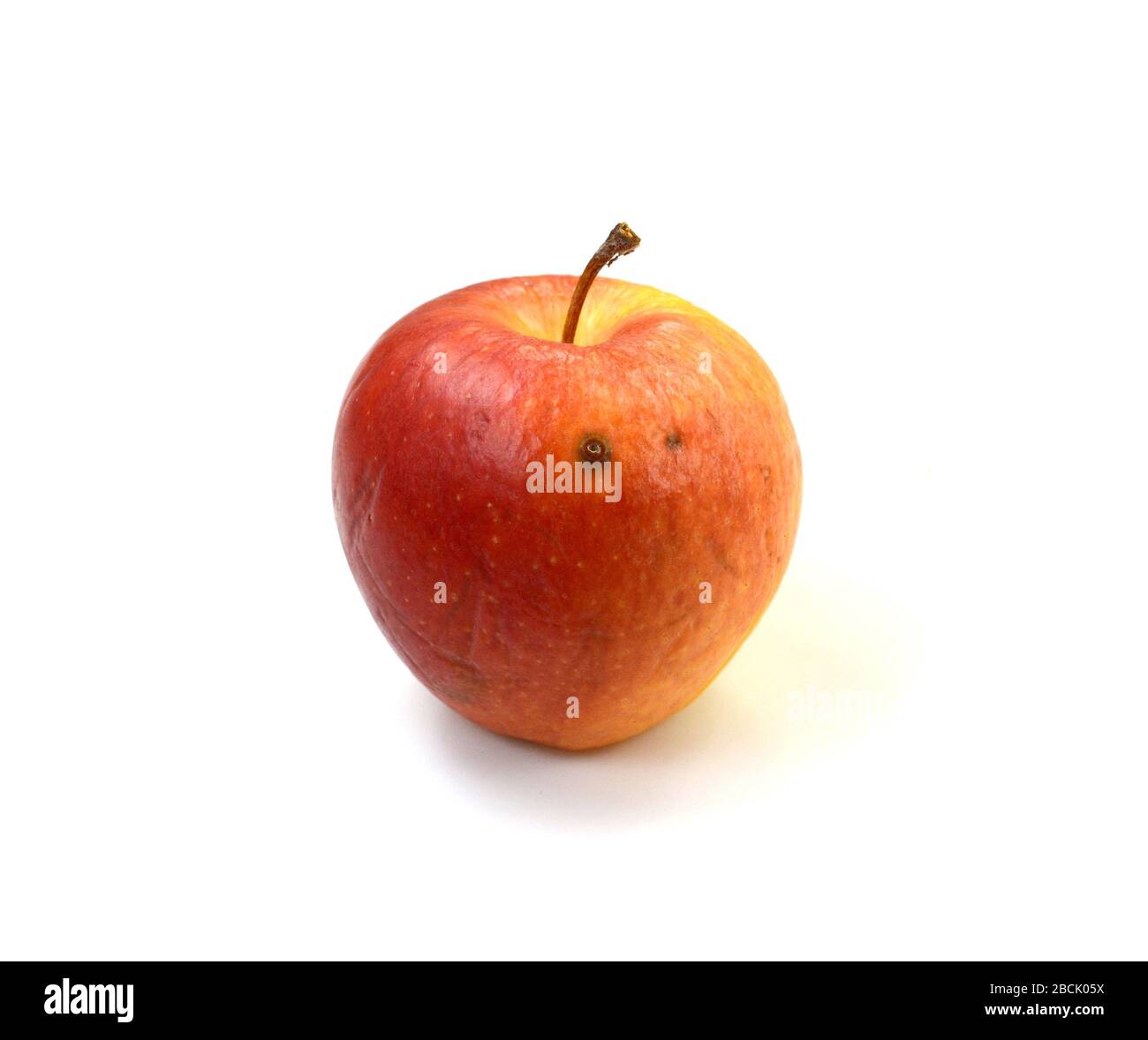 Overripe Rotten apple isolated on a white background Stock Photo - Alamy