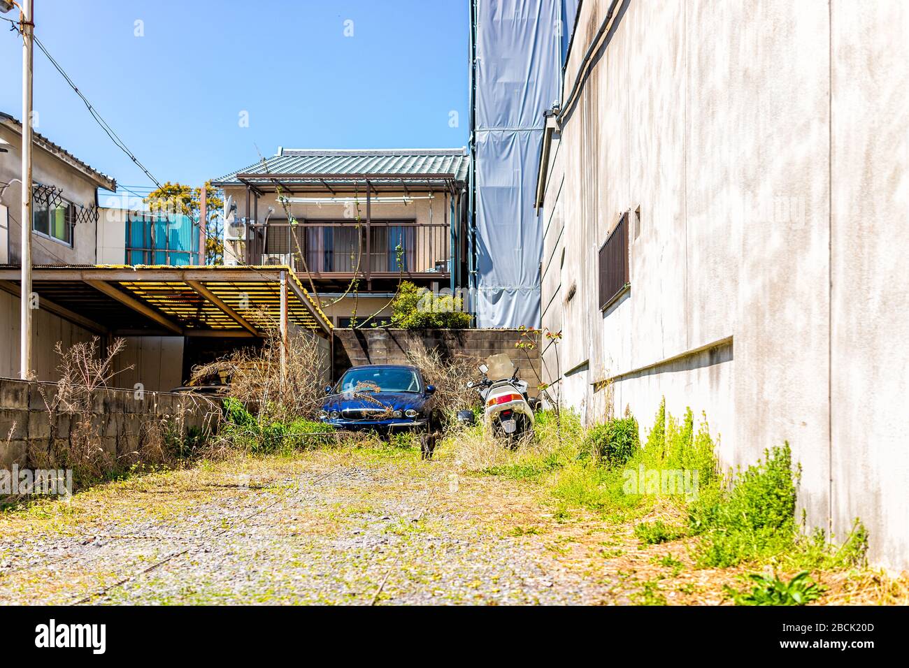 Kyoto residential neighborhood in spring in Japan with old cars by ...