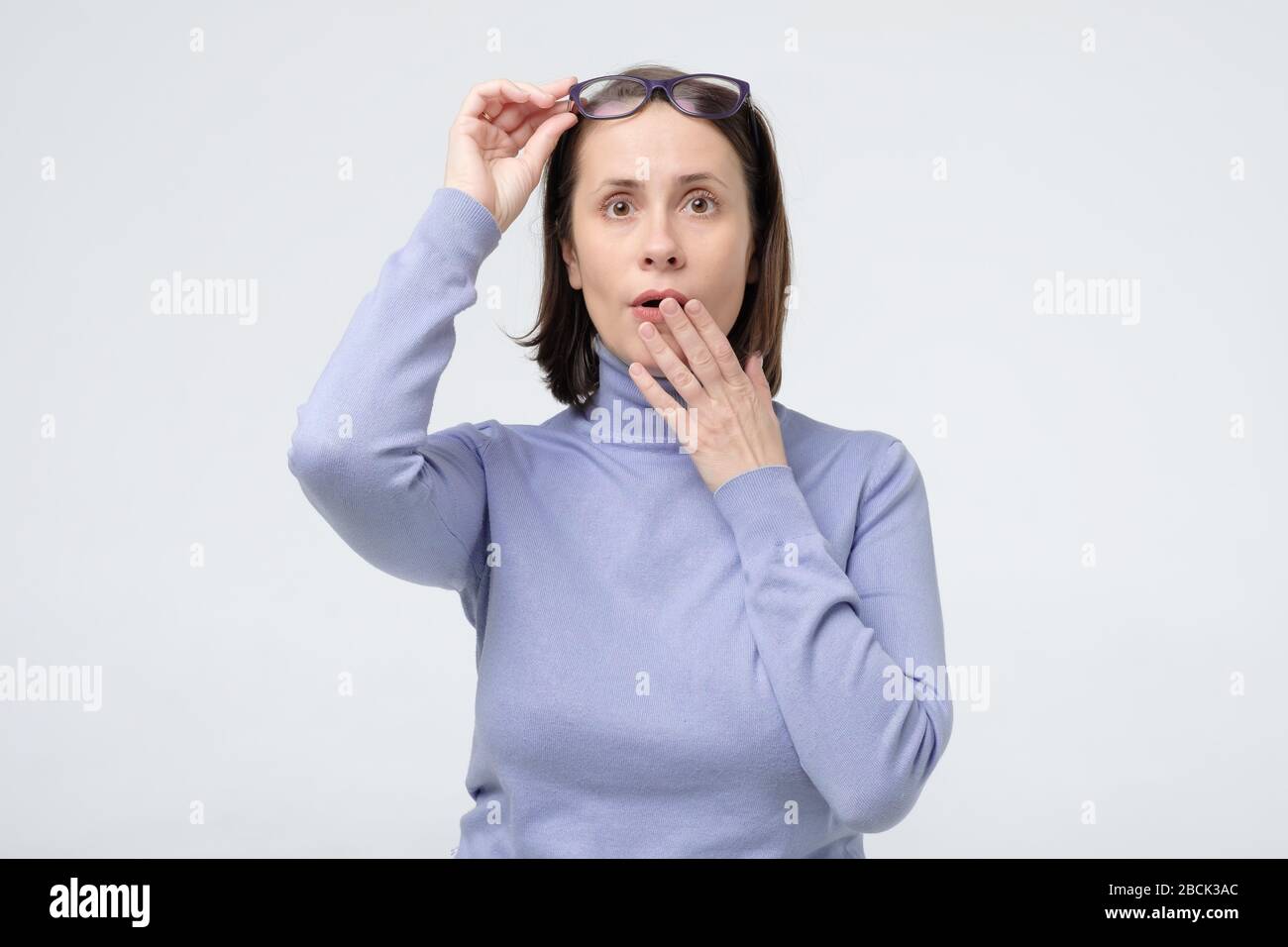 Mother hand over mouth hi-res stock photography and images - Alamy