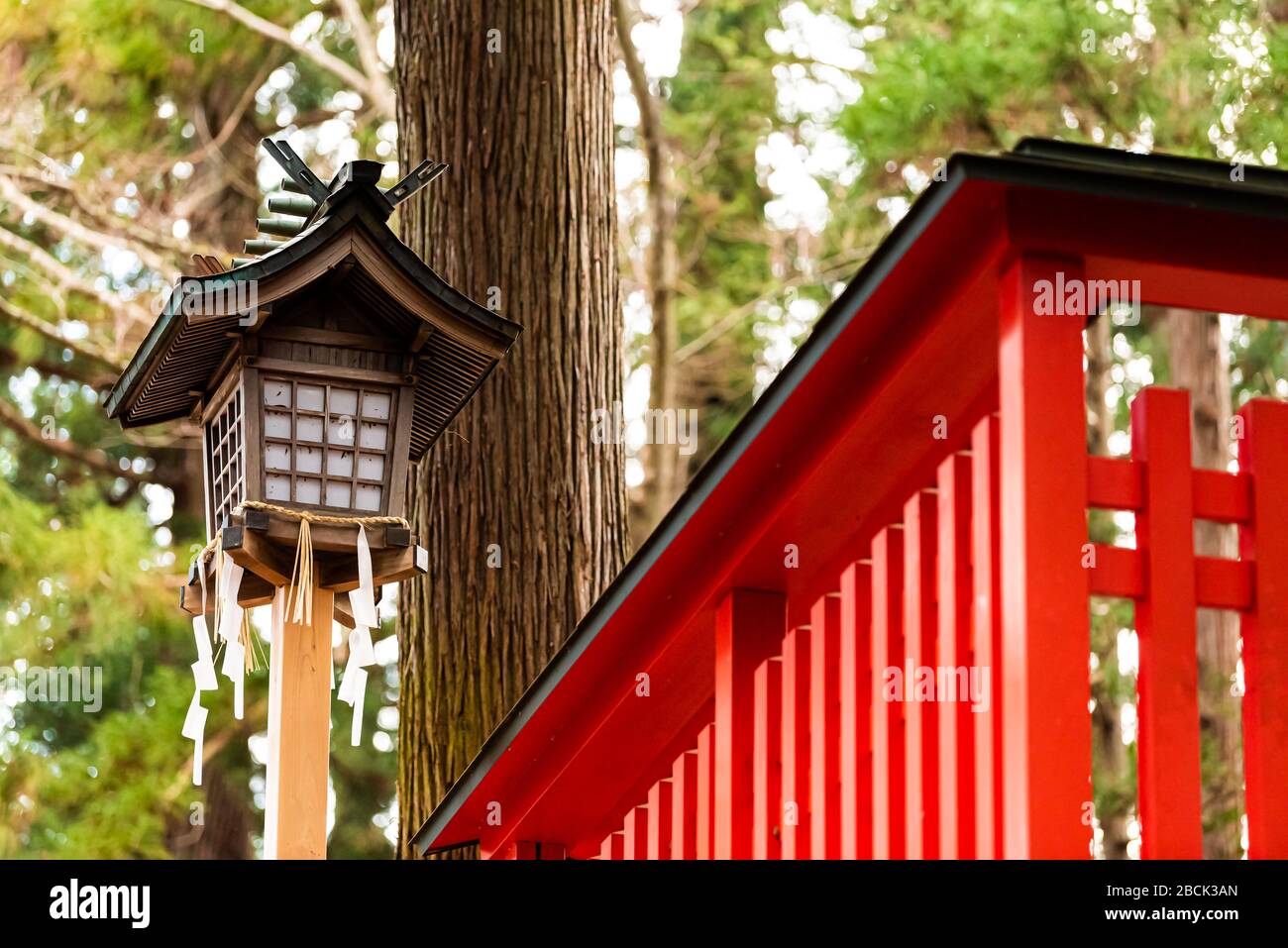 One wooden lamp lantern by red vermilion railing fence in Takayama ...