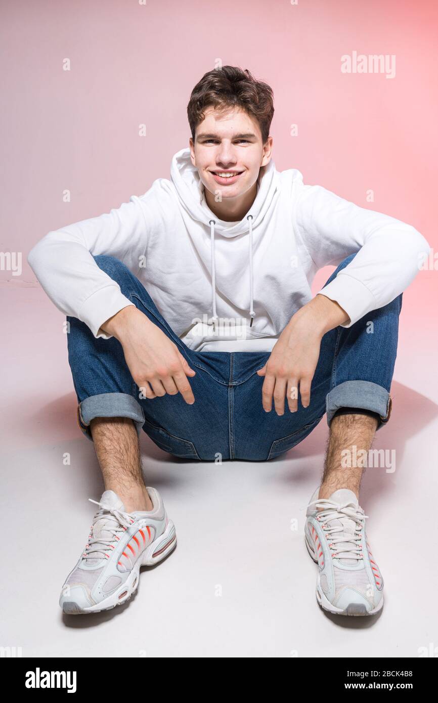 Fashionable handsome young European male model dressed in white ...