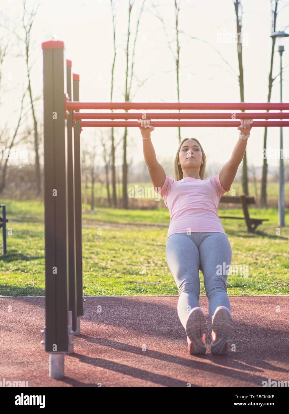 Girl doing pull ups hi-res stock photography and images - Alamy