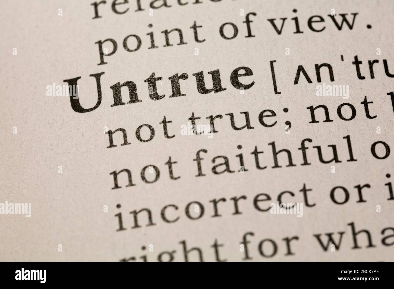 Fake Dictionary, Dictionary definition of word untrue Stock Photo - Alamy