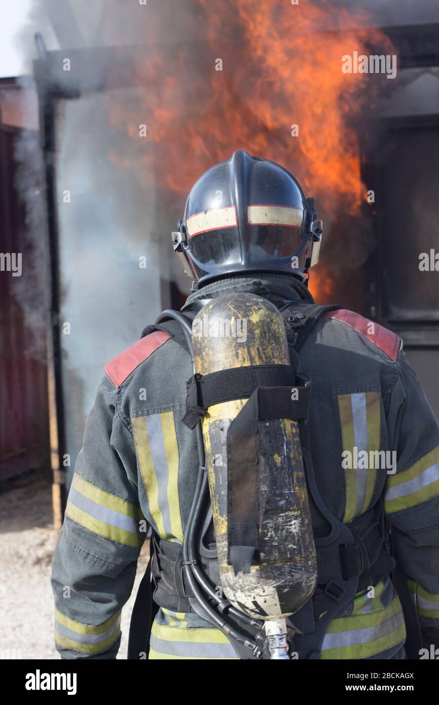 Firefighter putting out fire training station extinguisher backdraft ...