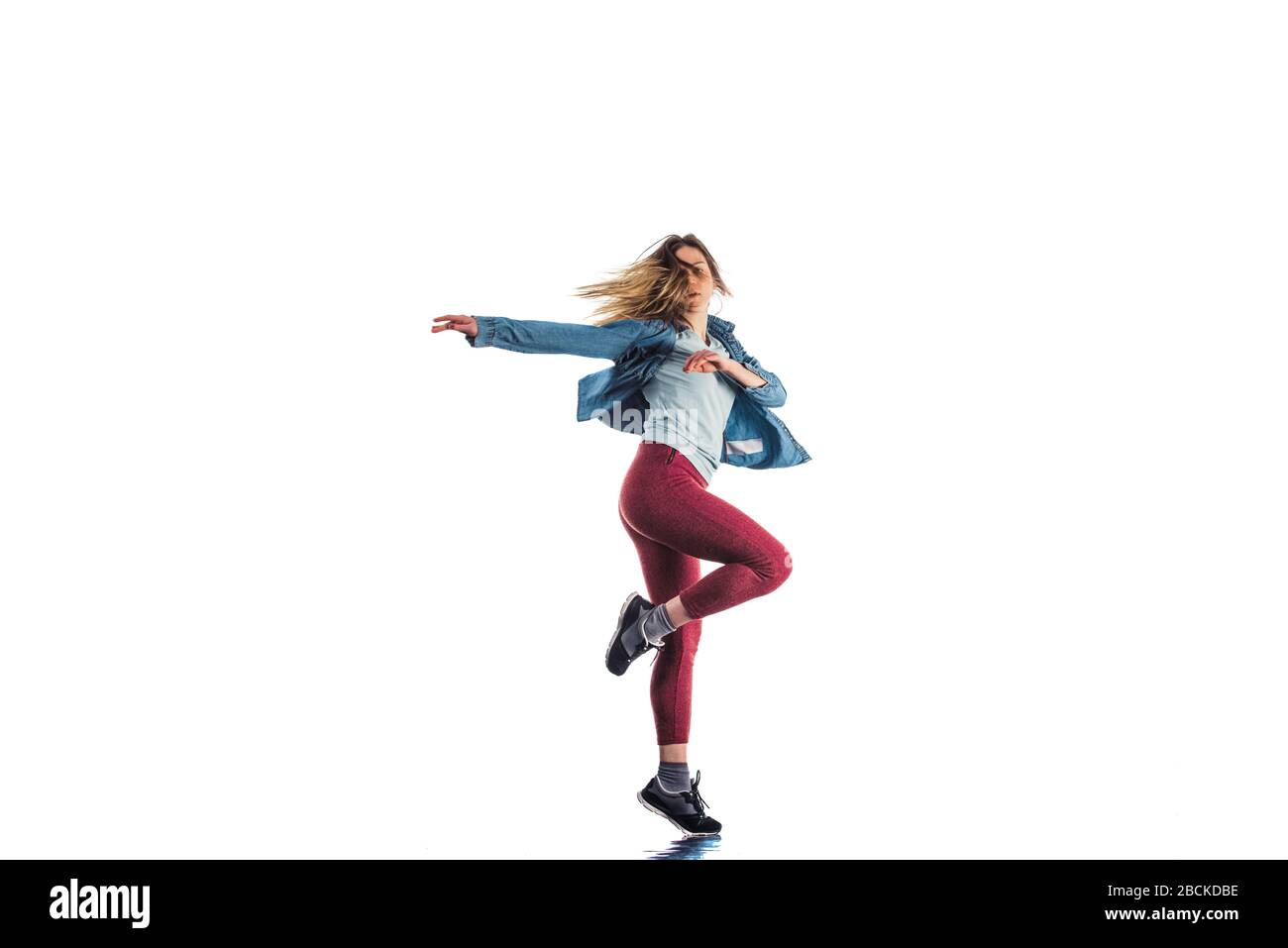 Modern girl doing break dance routine Stock Photo - Alamy
