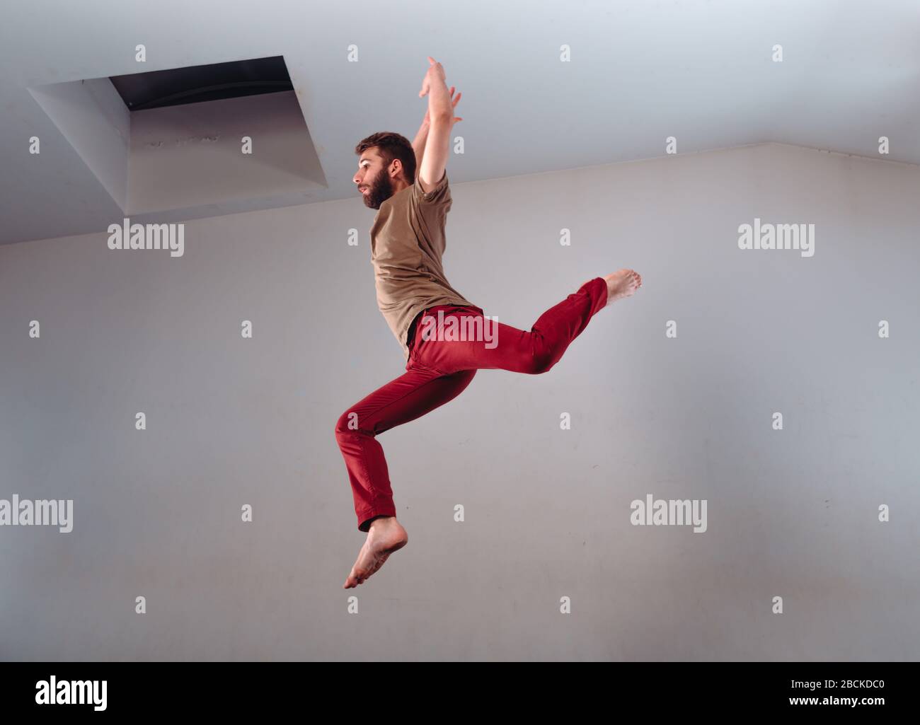 Young athletic man performing contemporary dance moves Stock Photo - Alamy
