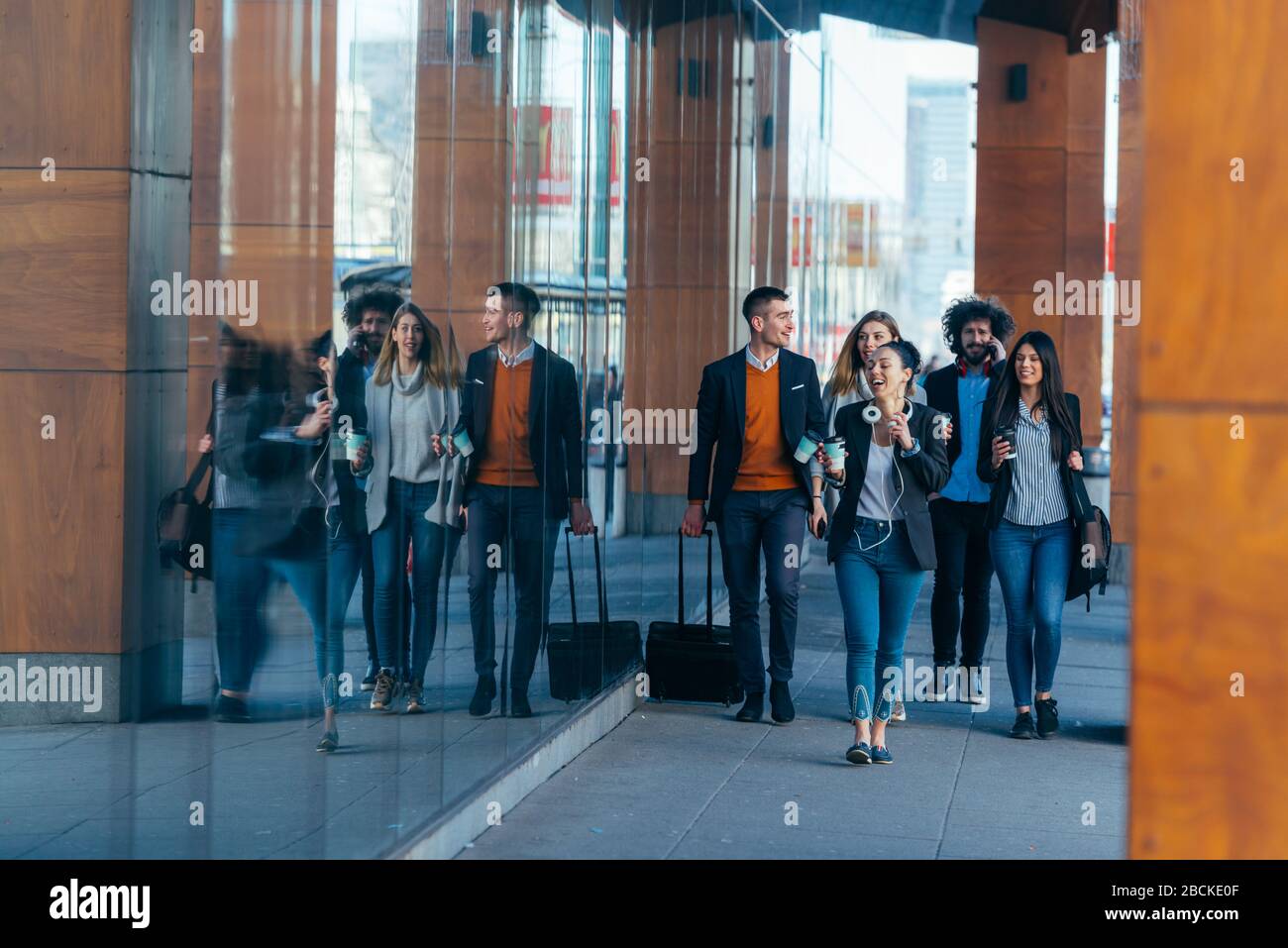 Group of colleagues on a business trip (euro trip) walking together at ...