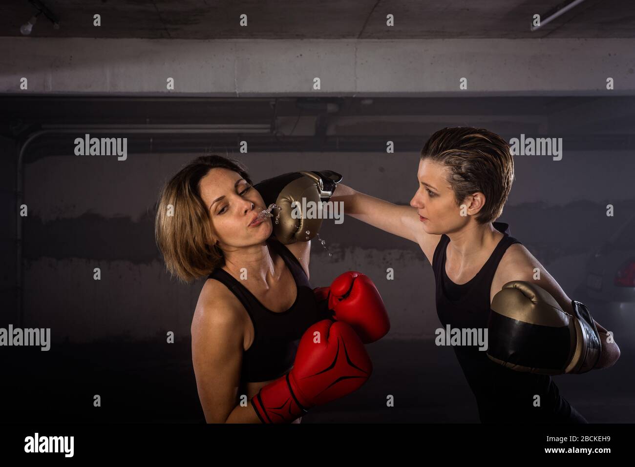 Close-up image of two female boxers with protective equipment ...