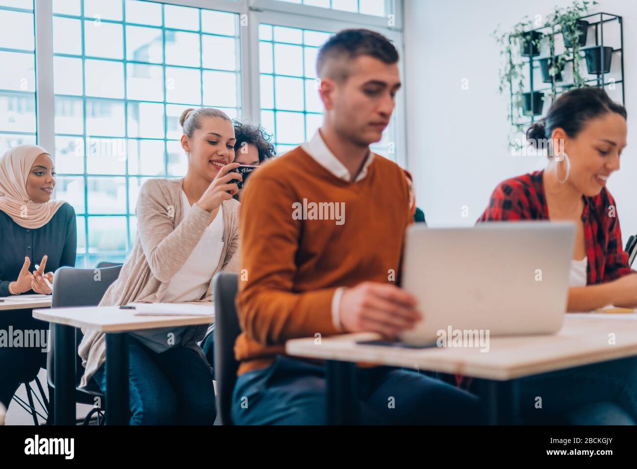 College students using laptops in class hi-res stock photography and ...