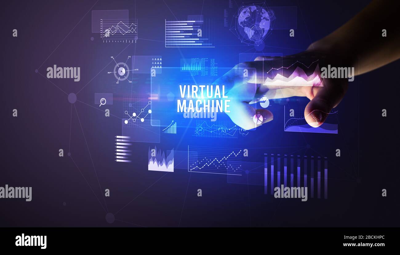 Hand touching VIRTUAL MACHINE inscription, new business technology ...