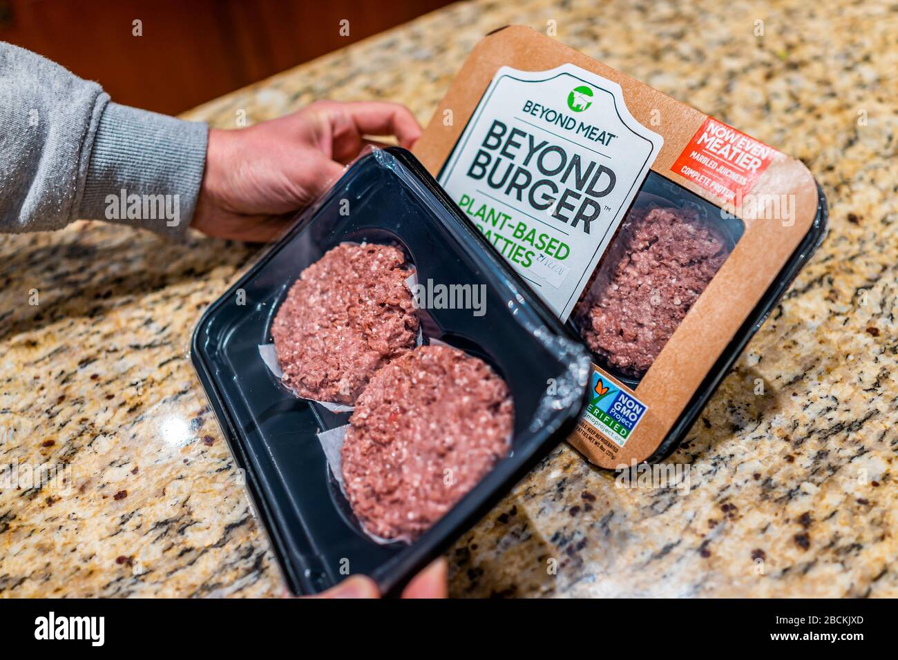 Herndon, USA - February 3, 2020: Man person holding uncooked Beyond ...