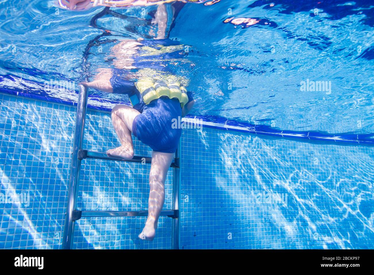 Climbing Out Of Swimming Pool High Resolution Stock Photography and ...