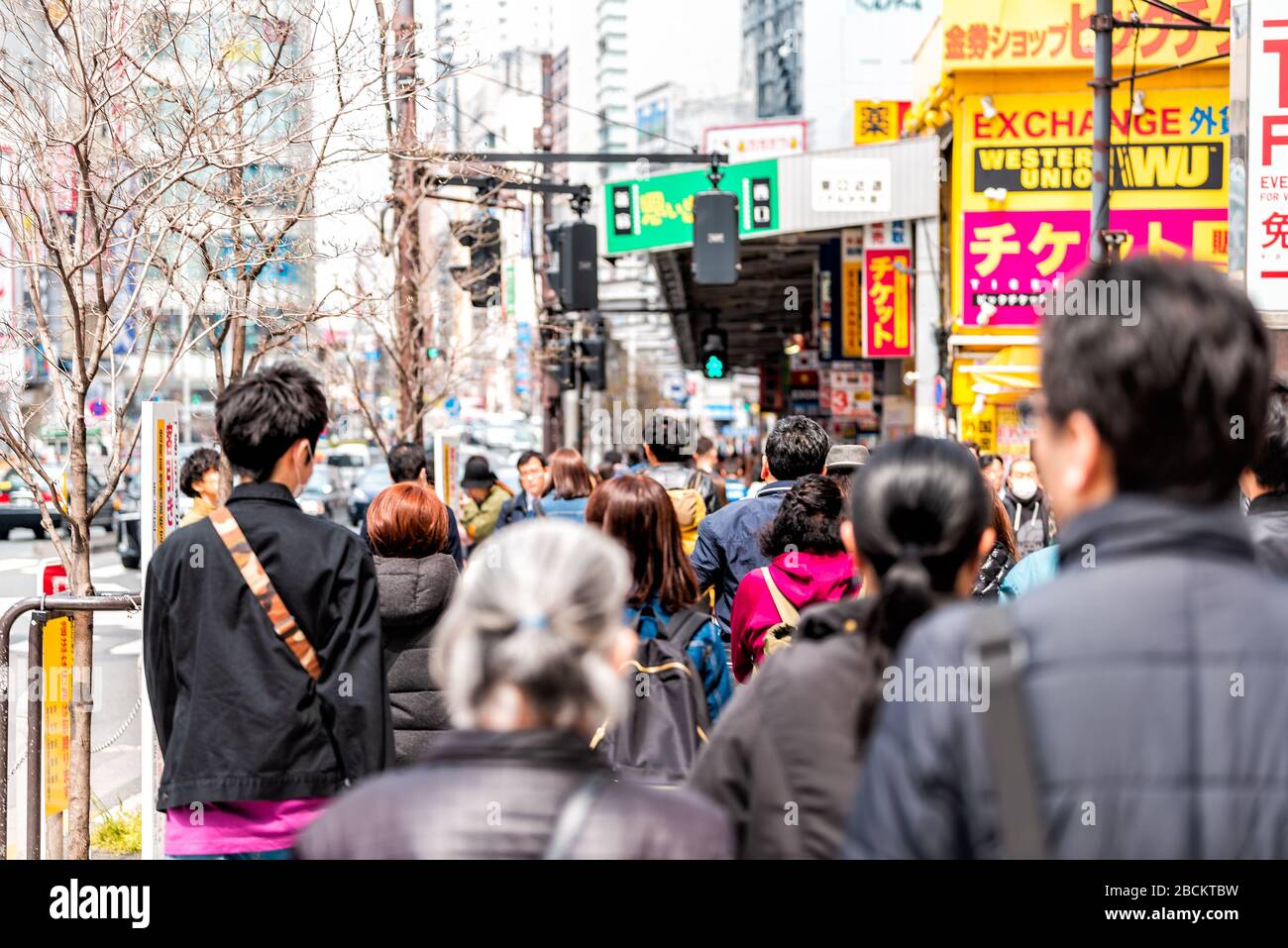 Tokyo, Japan - March 31, 2019: Shinjuku street sidewalk with crowd many ...