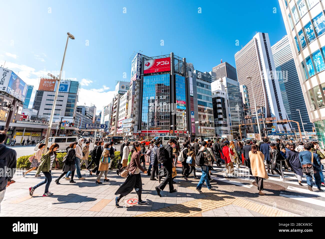 Tokyo, Japan - April 1, 2019: Shinjuku street sidewalk with traffic of ...