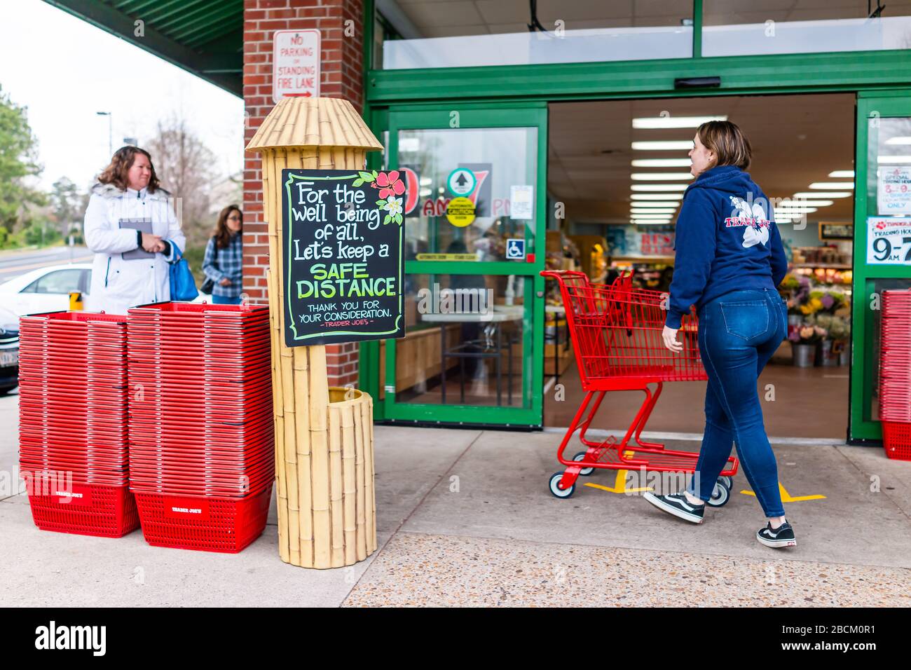 Reston, USA - April 1, 2020: Trader Joe's grocery store sign for social ...