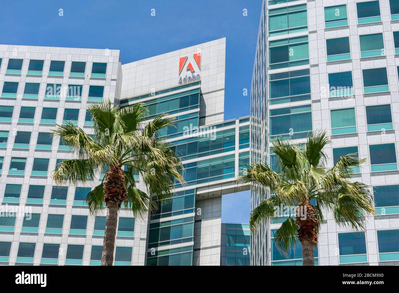 Adobe logo is displayed on Adobe Inc. office headquarters towers. Logo ...