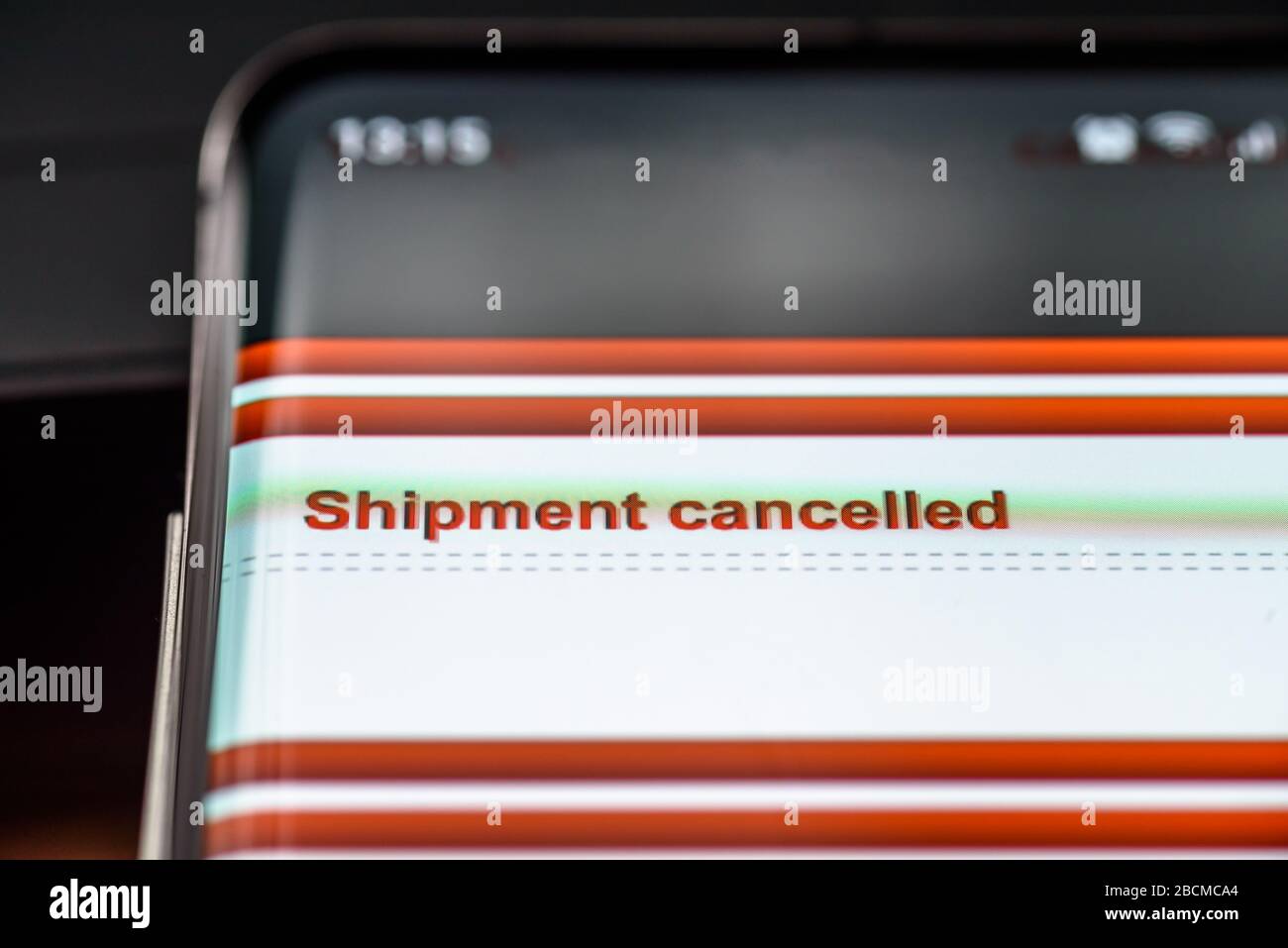 shipment cancelled text on smart phone screen Stock Photo - Alamy