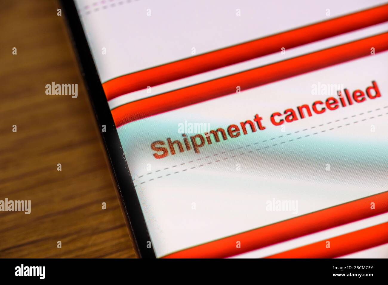 shipment cancelled text on smart phone screen Stock Photo - Alamy