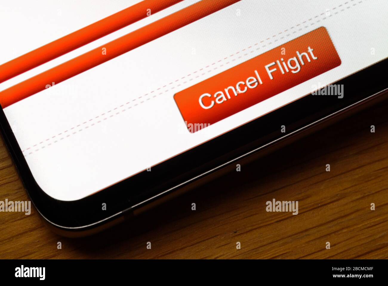 cancel flight text button on smart phone screen Stock Photo - Alamy