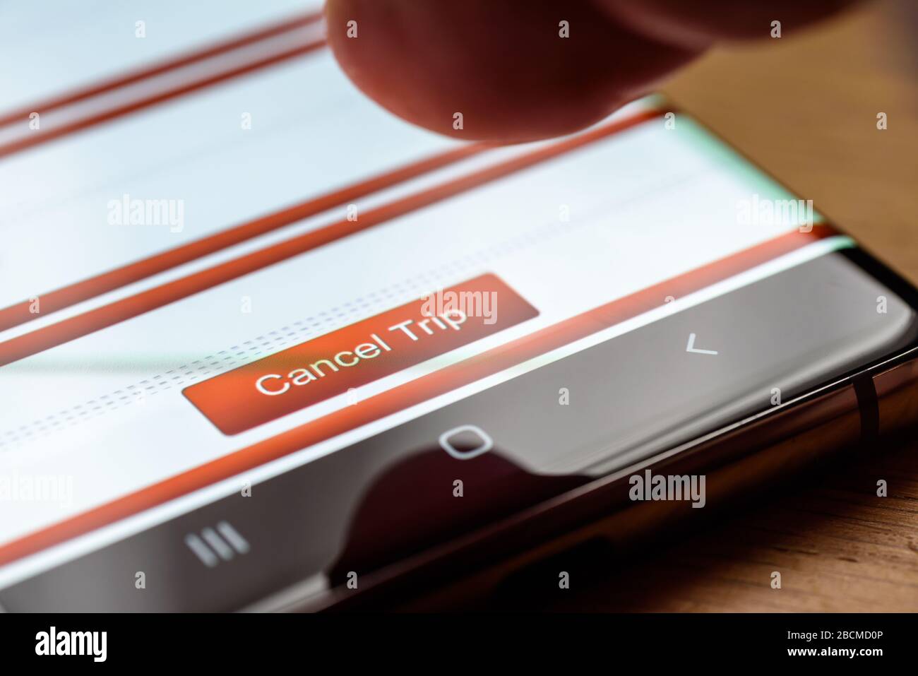 cancel trip text button on smart phone screen Stock Photo - Alamy