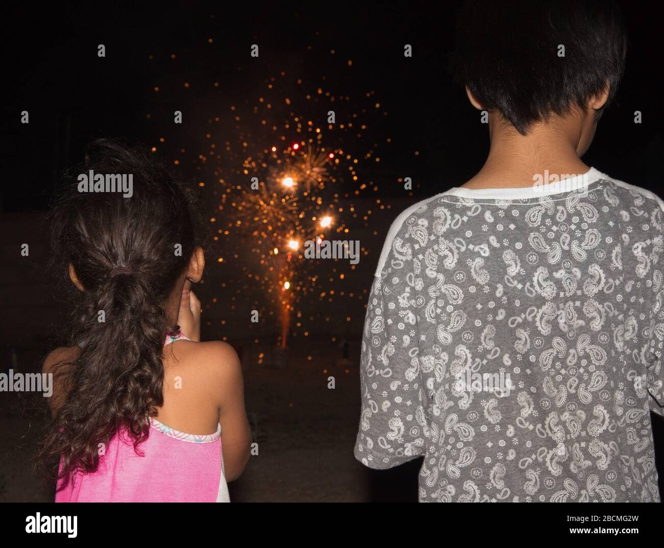 Children watching Fourth of July Fireworks at home at night Stock Photo ...