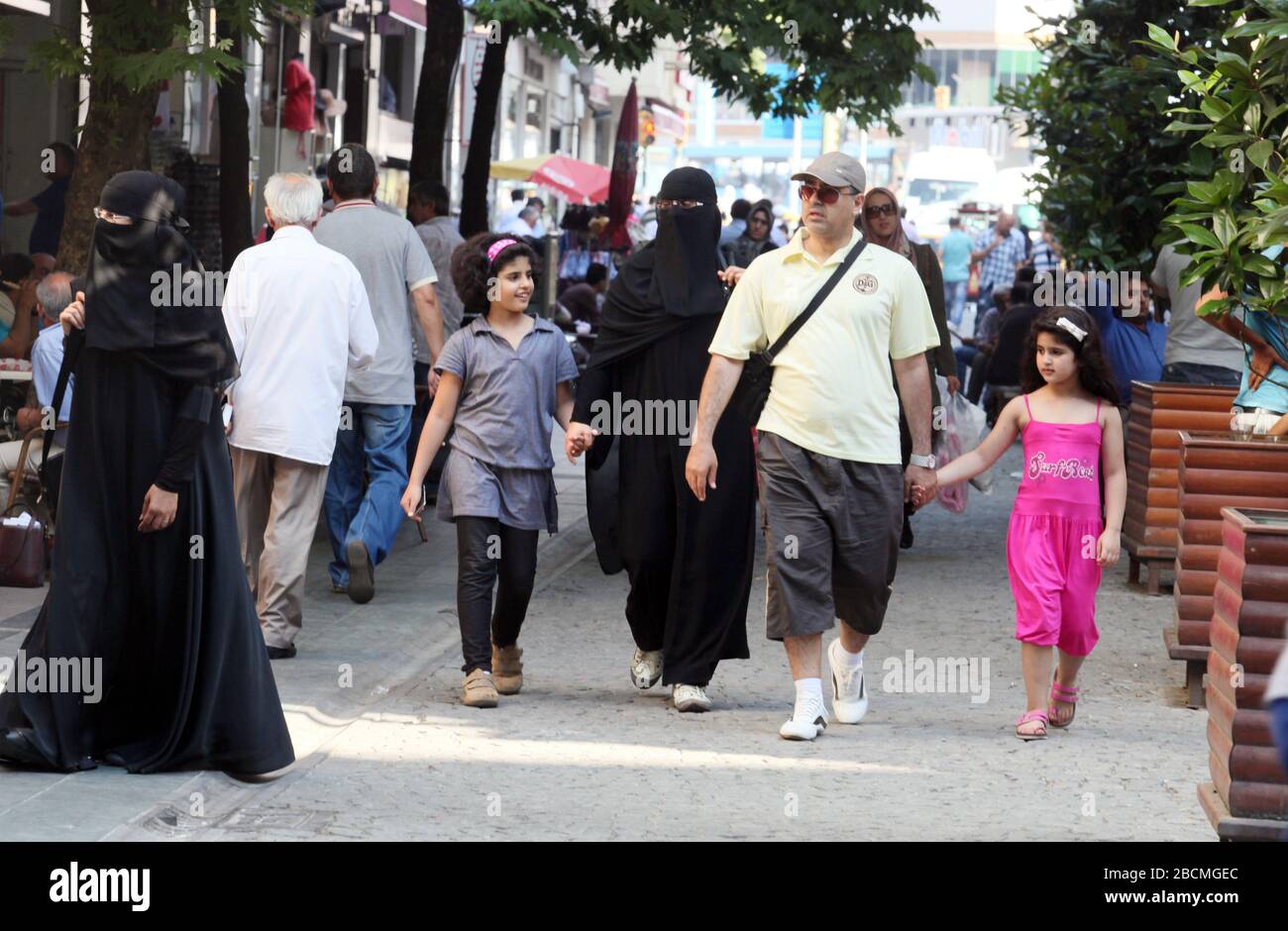 ISTANBUL, TURKEY - JULY 14: Arab tourists walking at Taksim Square on ...