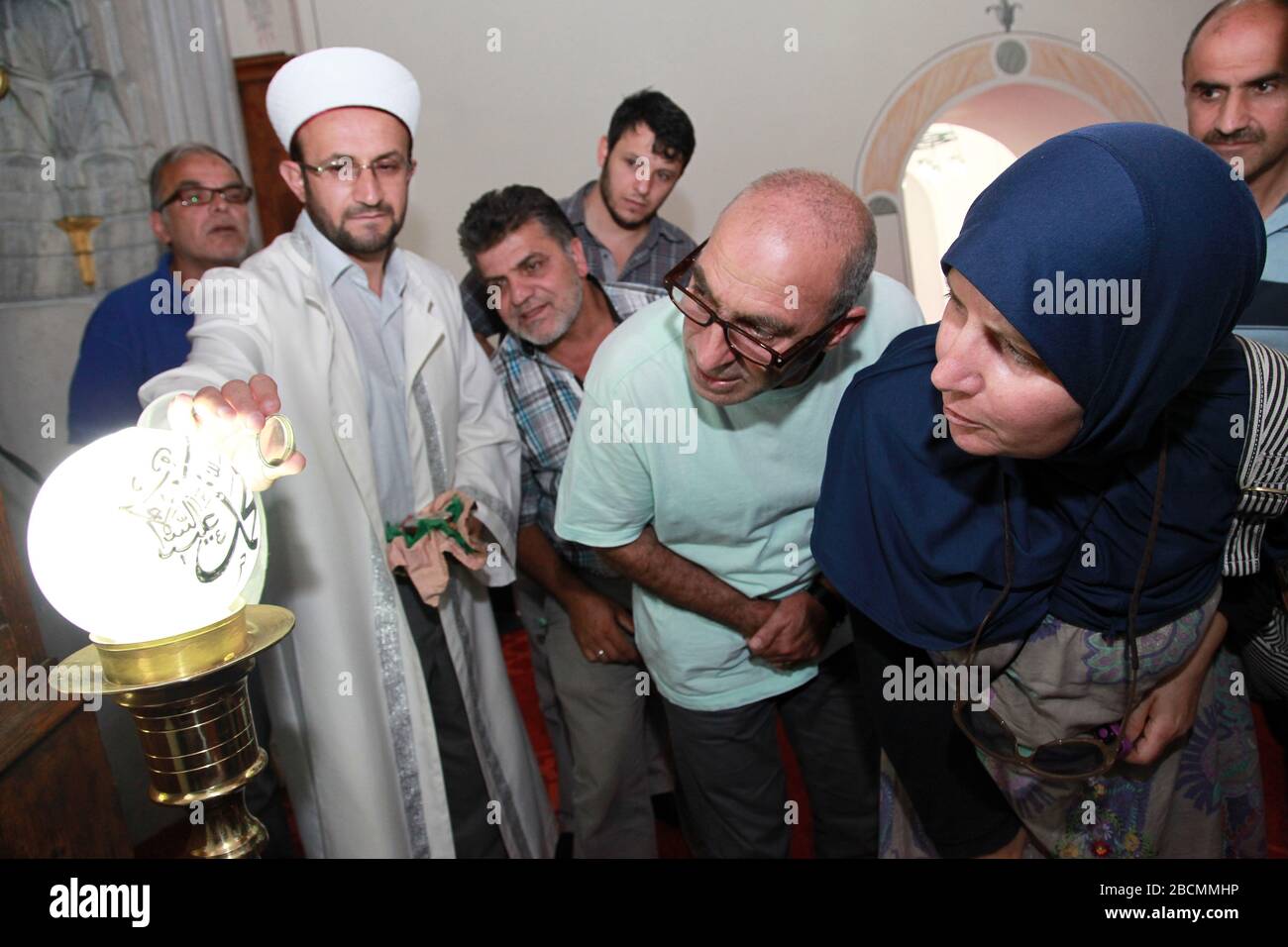 ISTANBUL, TURKEY - JULY 23: Prayer leader (imam) showing Prophet ...