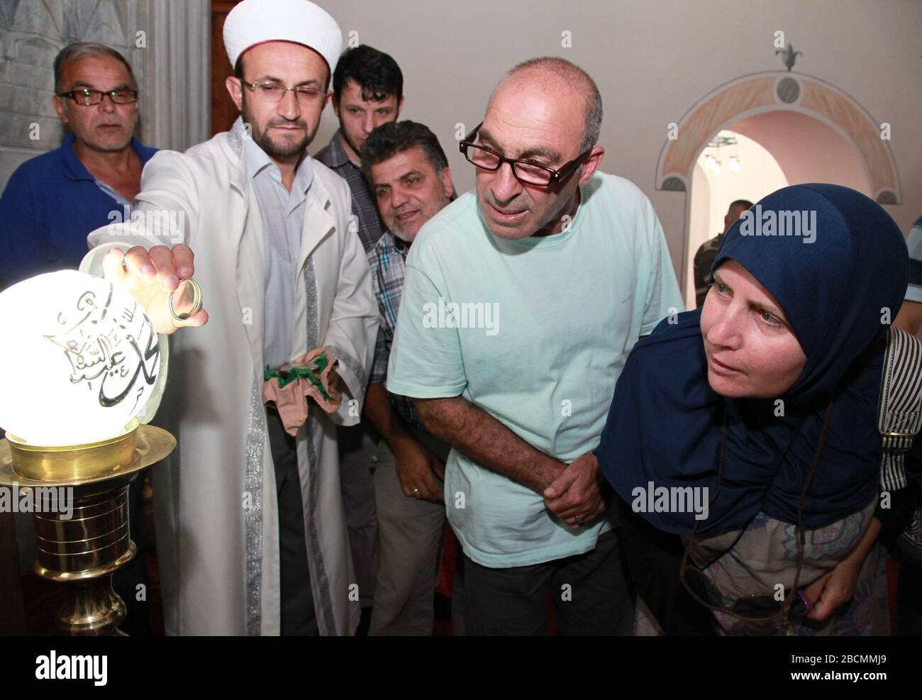 ISTANBUL, TURKEY - JULY 23: Prayer leader (imam) showing Prophet ...