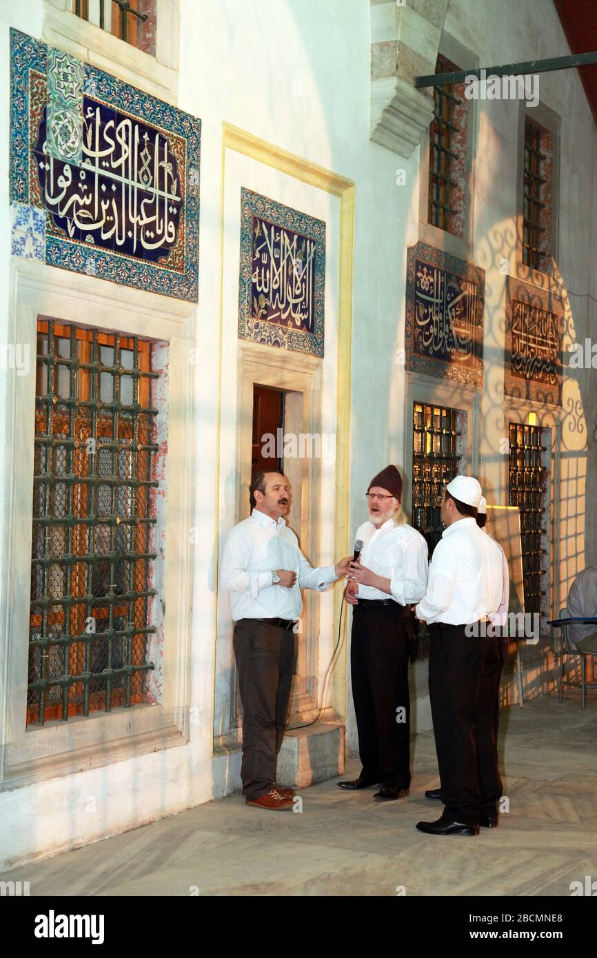 ISTANBUL, TURKEY - JULY 23: Prayer leaders (imam) talking muslum groups ...