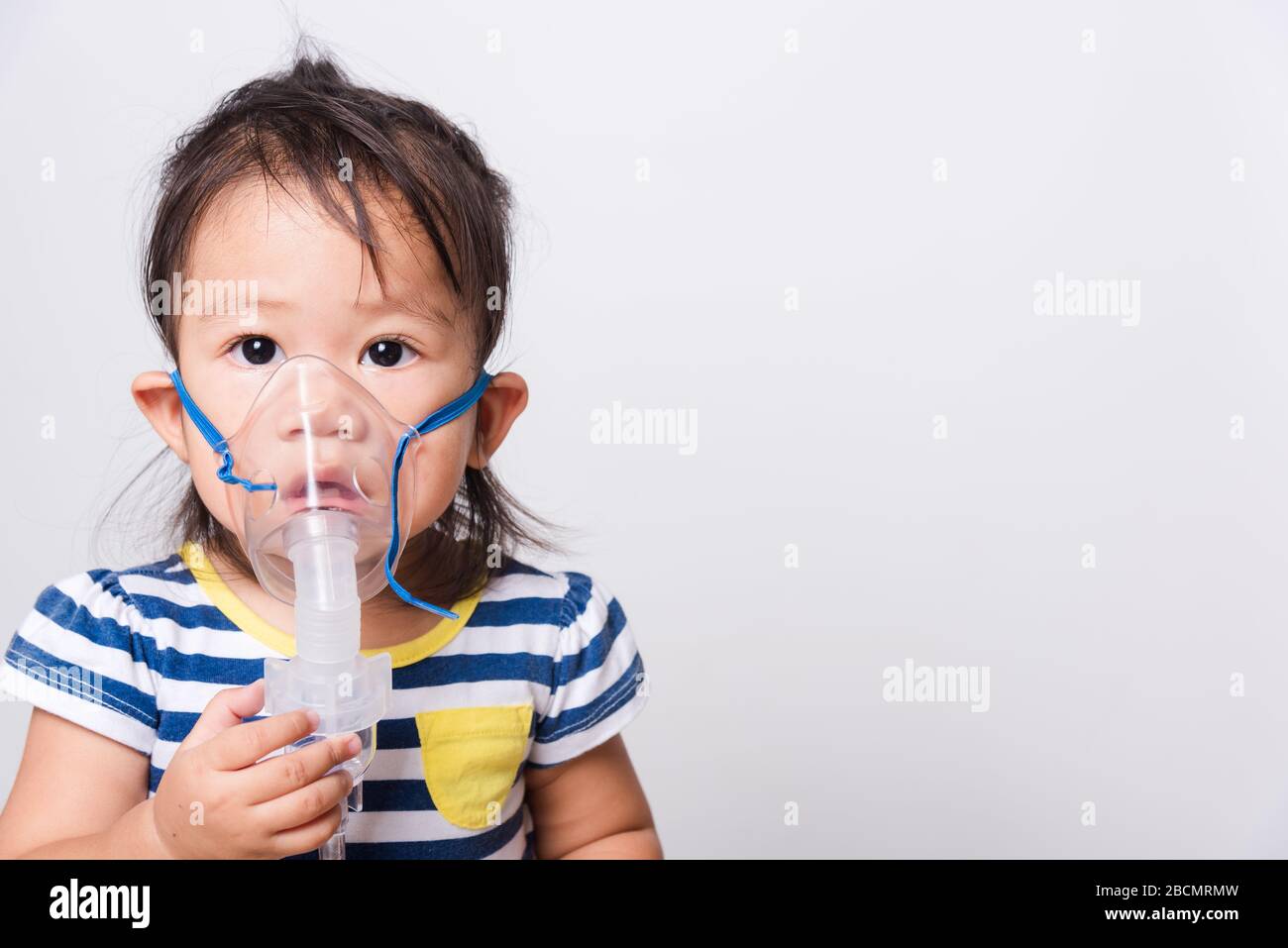 Closeup Asian face, Little baby girl sick her using steam inhaler ...