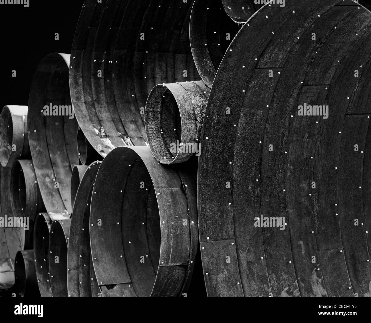 A wall of steel wonderfully textured banded steel tubes form a wall in ...