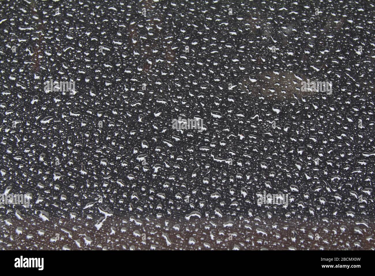 Beautiful background texture of rain water drops on grey black metal ...