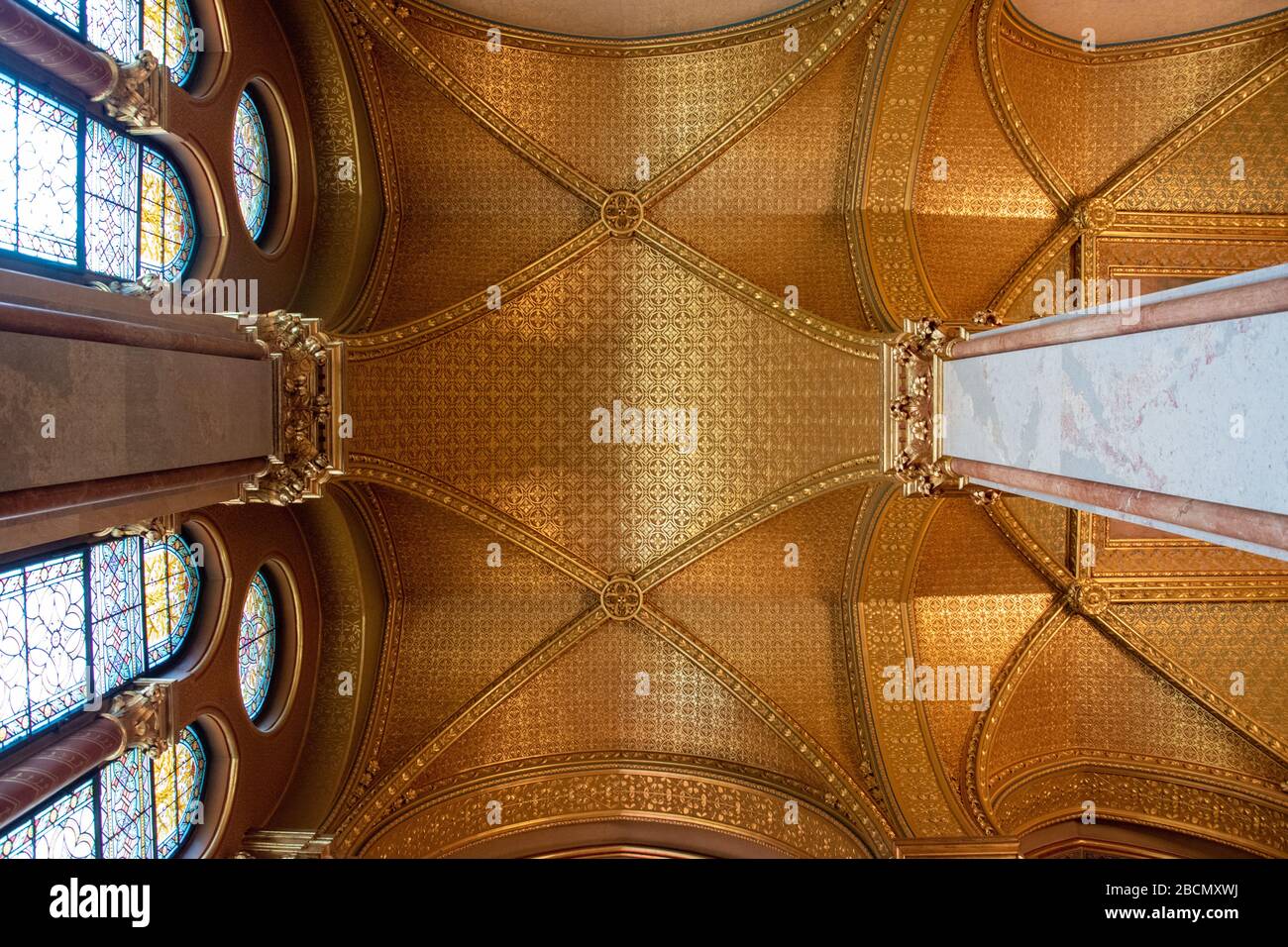 The golden gilded ceiling in the staircase of the Parliament building ...
