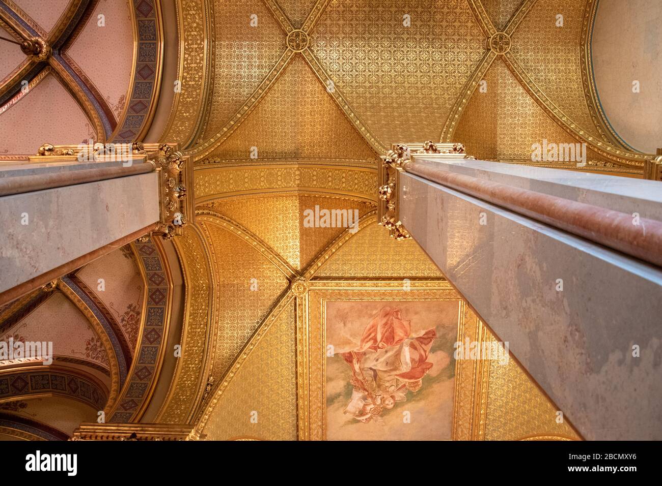 The golden gilded ceiling in the staircase of the Parliament building ...