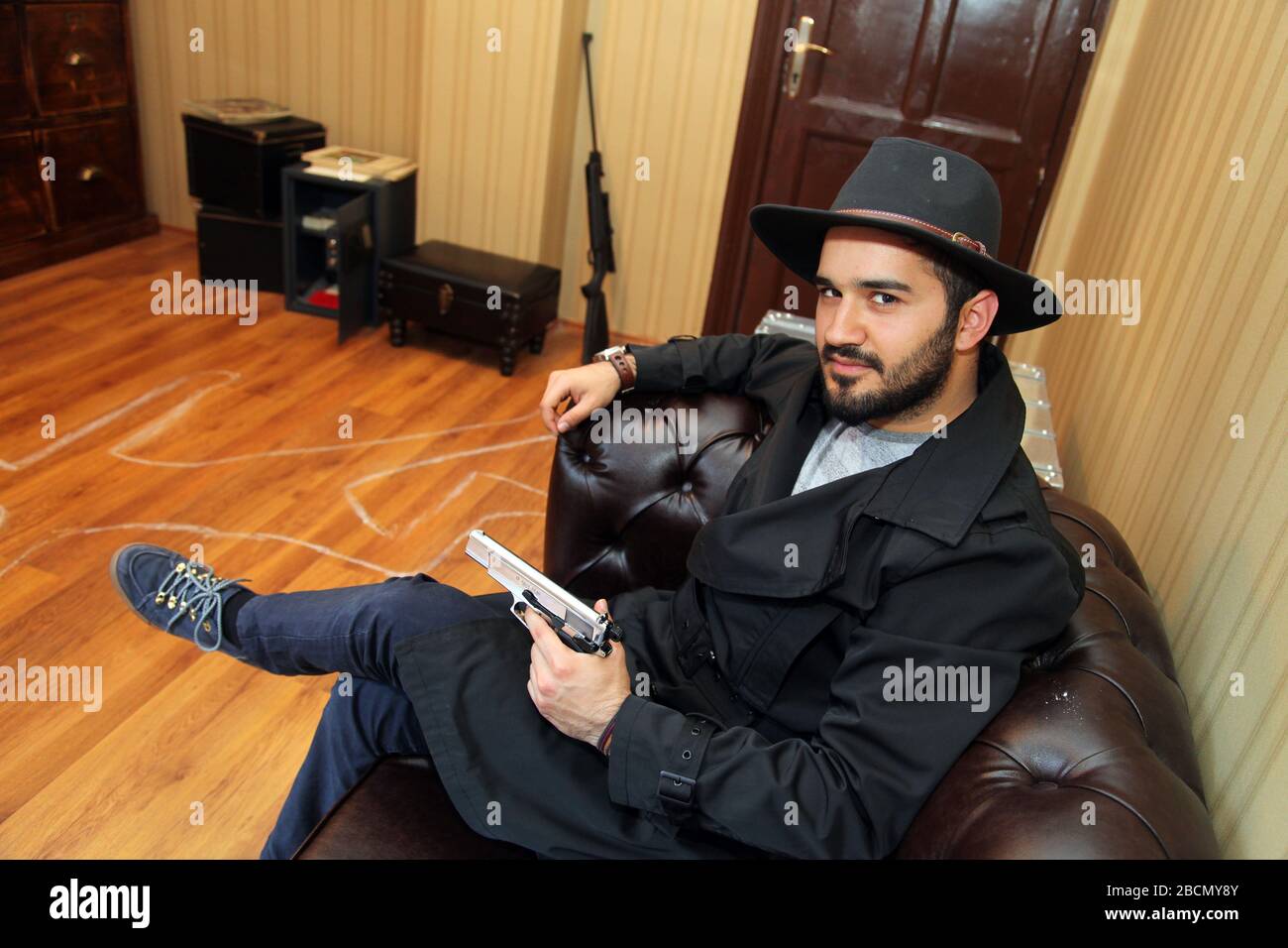 ISTANBUL, TURKEY - MAY 15: Turkish private detective working his desk ...