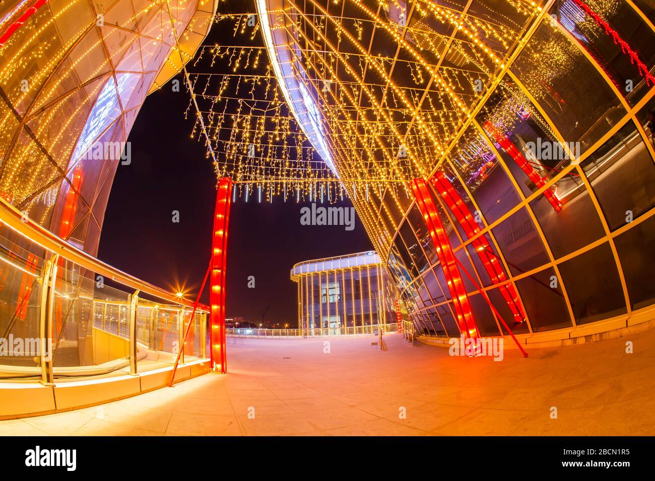 Glass walled buildings at night Stock Photo - Alamy
