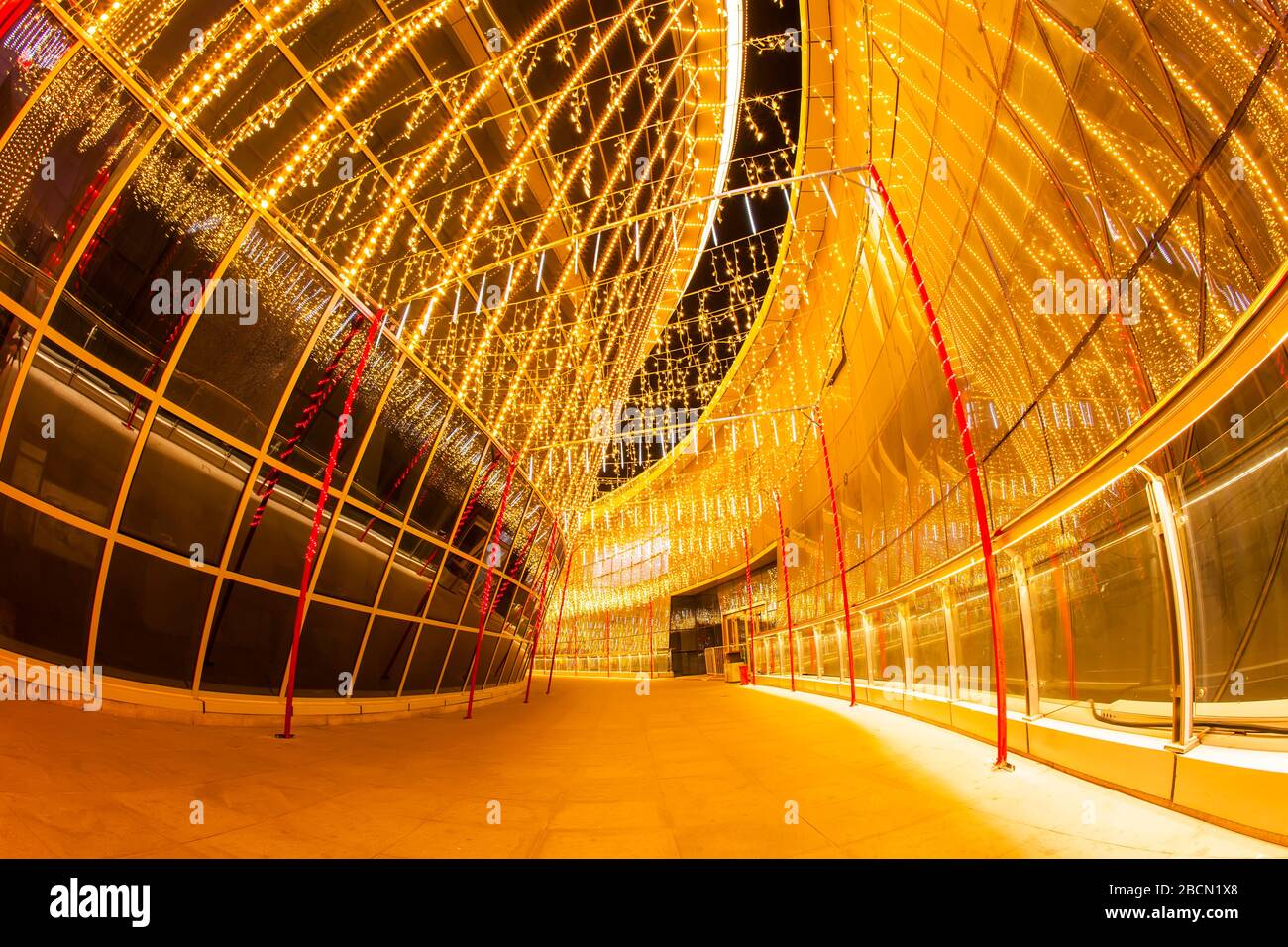 Glass walled buildings at night Stock Photo - Alamy