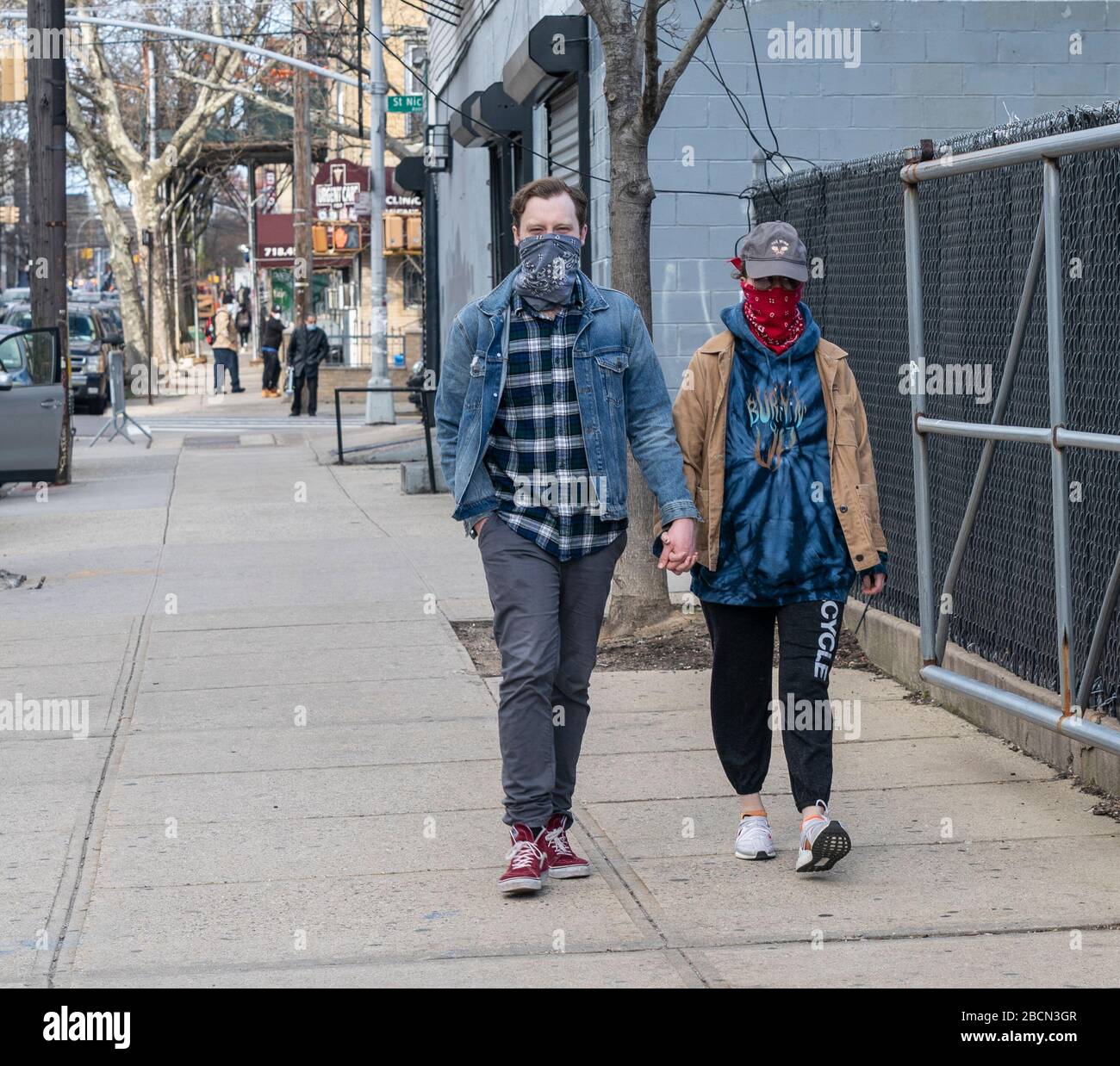 New York, NY - April 4, 2020: Couple wearing bandanas as facial masks ...