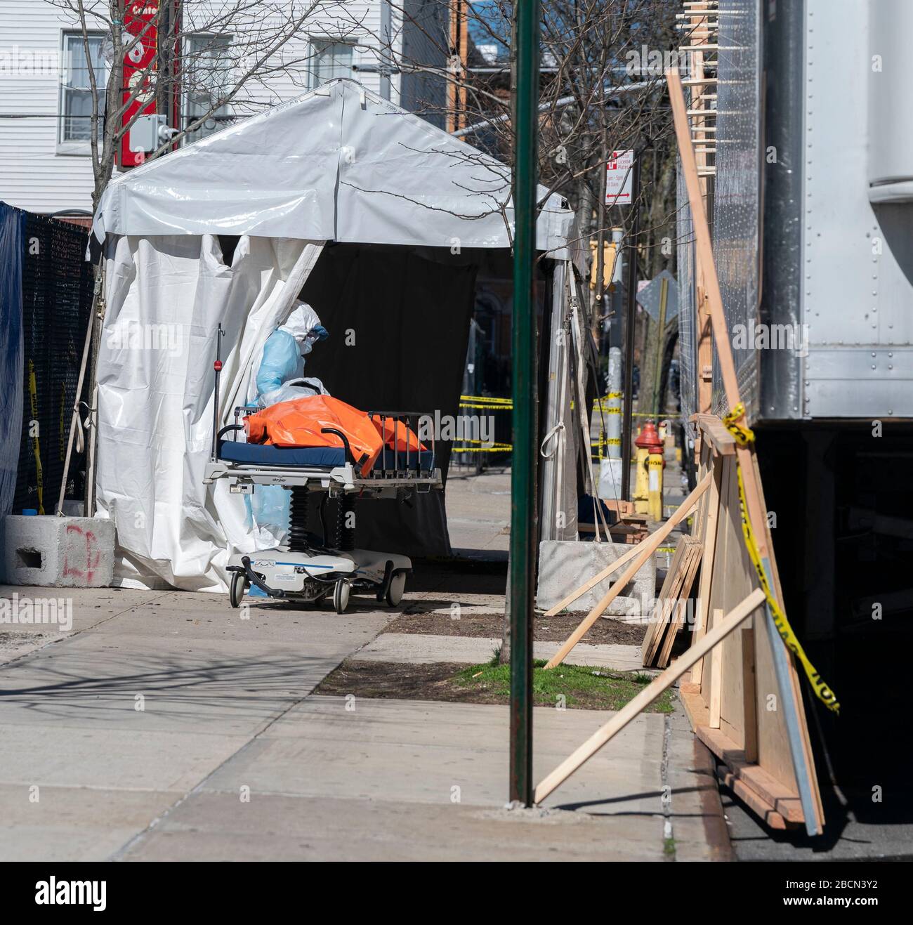 New York, NY - April 4, 2020: Body of deceased patient in orange bag ...