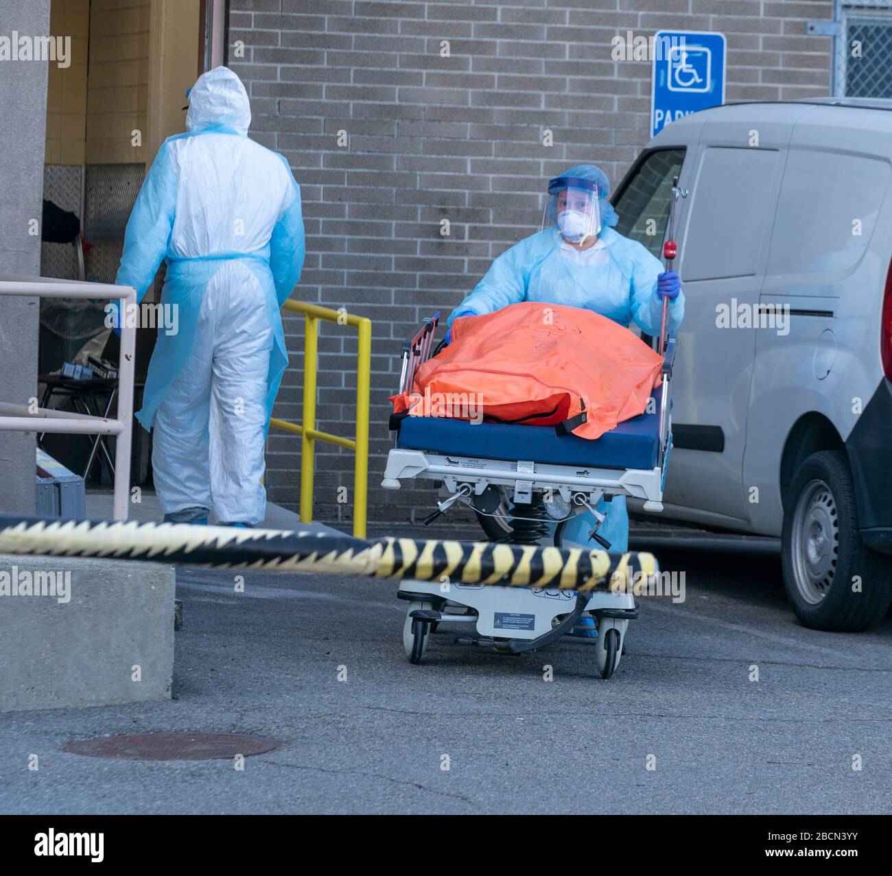 New York, NY - April 4, 2020: Body of deceased patient in orange bag ...