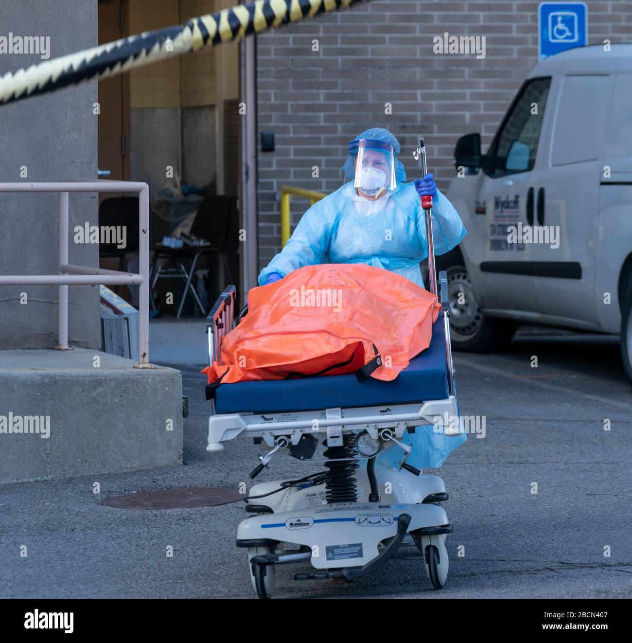 New York, NY - April 4, 2020: Body of deceased patient in orange bag ...