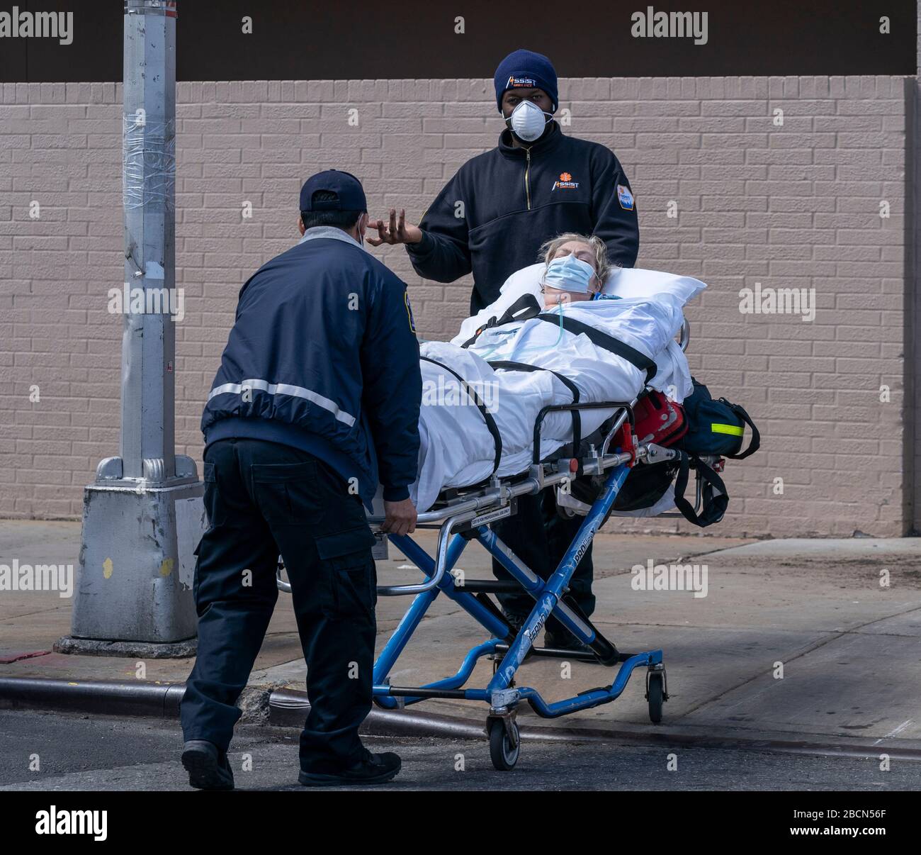 New York, NY - April 4, 2020: EMT members bring sick patient to ...