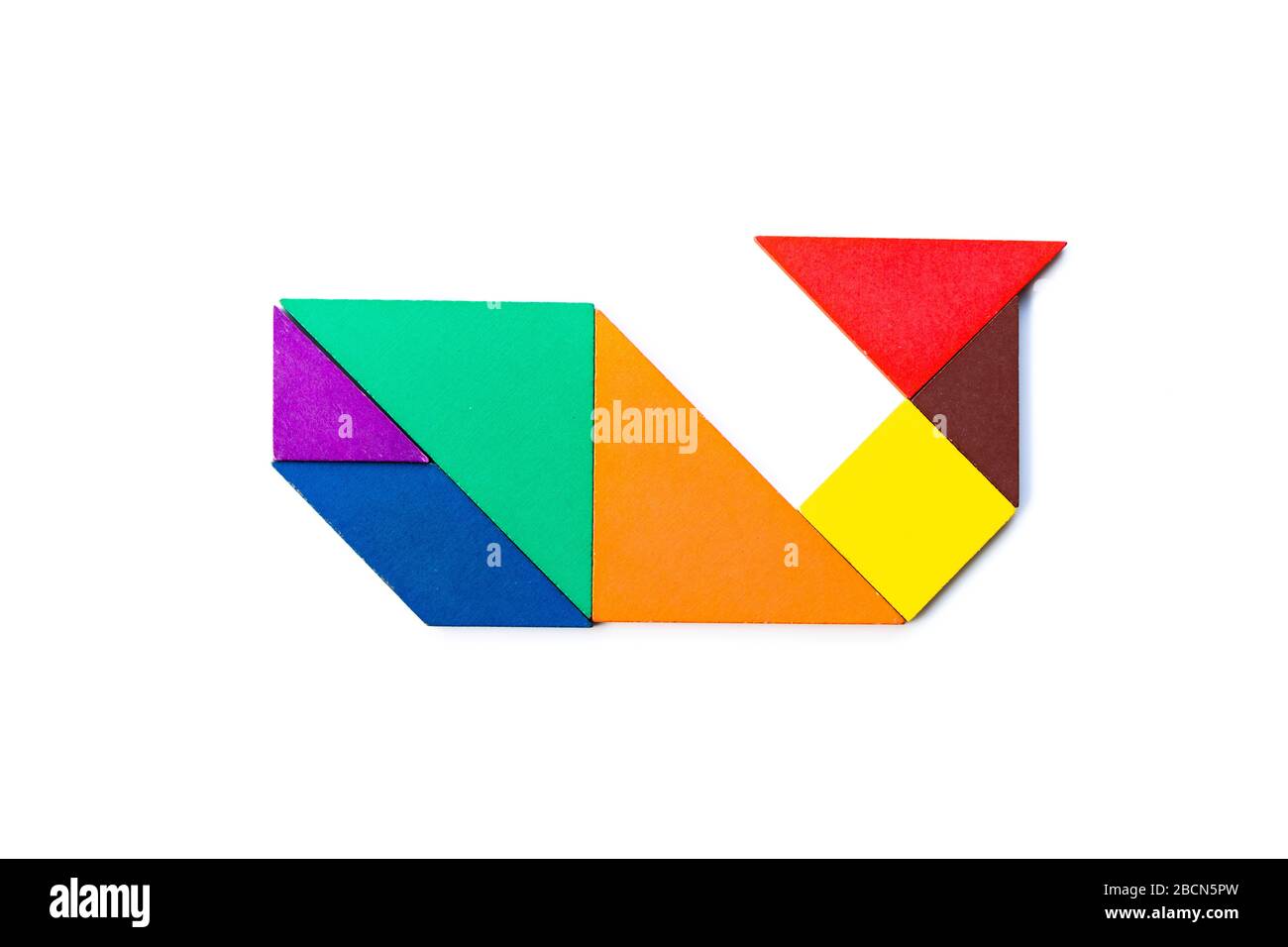 Color wood tangram puzzle in whale, fish or shark shape on white ...