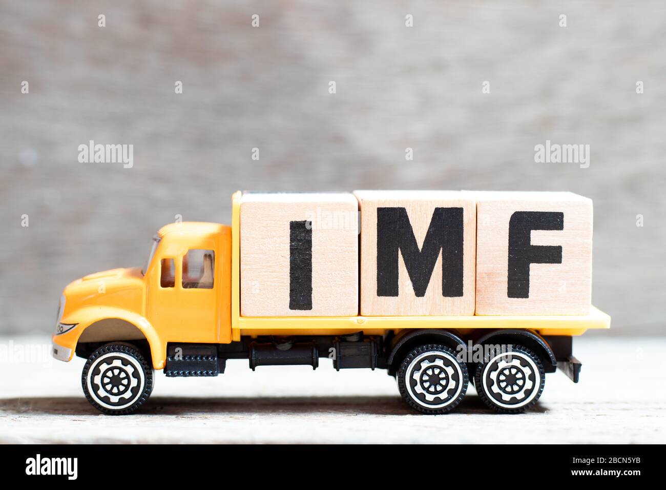 Truck hold letter block in word IMF (abbreviation of International ...