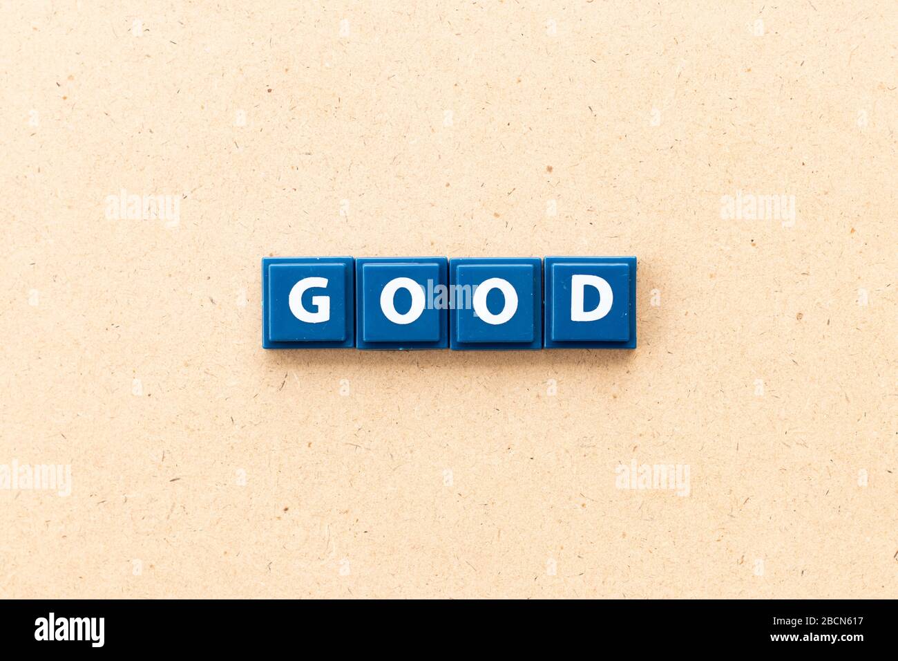 Tile letter in word good on wood background Stock Photo - Alamy