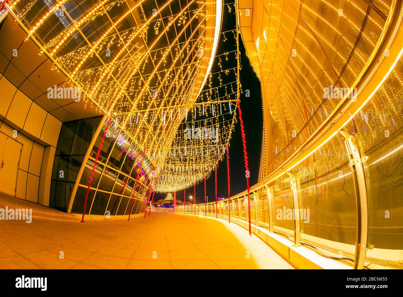 Glass walled buildings at night Stock Photo - Alamy