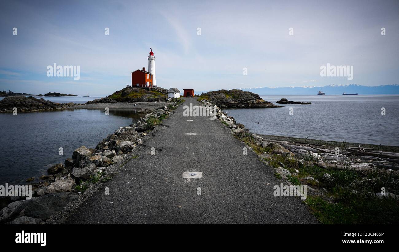Empty road to majestic lighthouse in Canada on Vancouver Island Stock ...